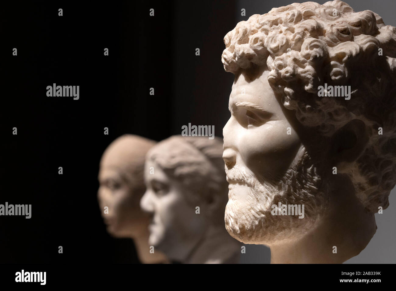 ancient roman head marble sculpture isolated on black background Stock ...