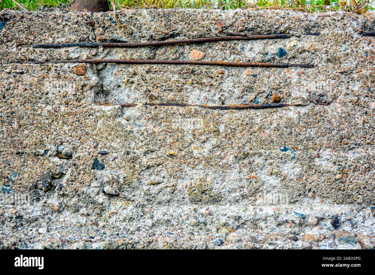 Texture of crumbling concrete wall with horizontal bars of rusty iron ...