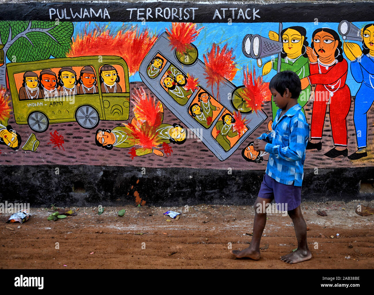 Village Kid Walks Past A Decorated Wall Naya Village Under Pingla Block village-kid-walks-past-a-decorated-wall-naya-village-under-pingla-block