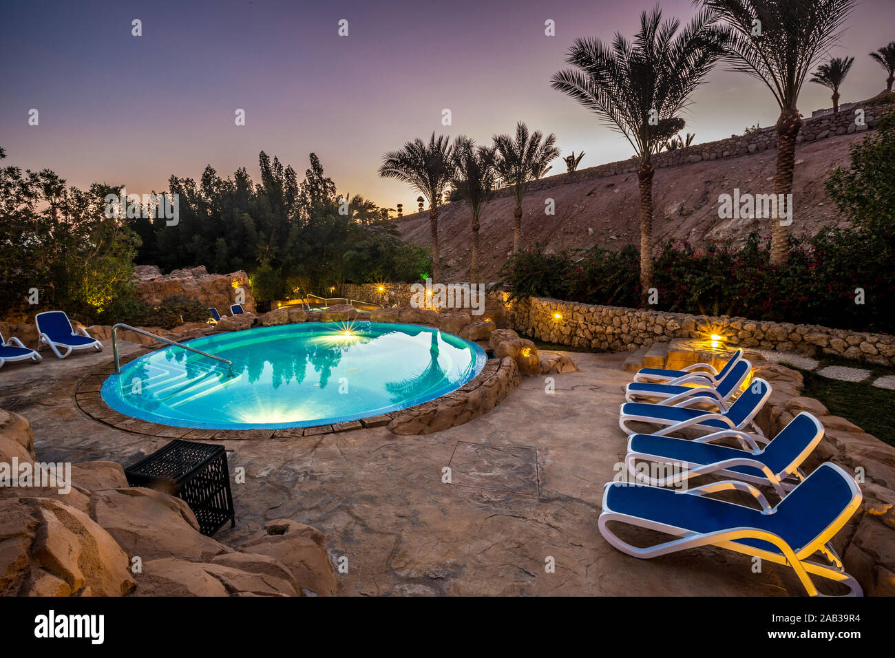 Evening view for luxury swimming pool in night illumination Stock Photo ...