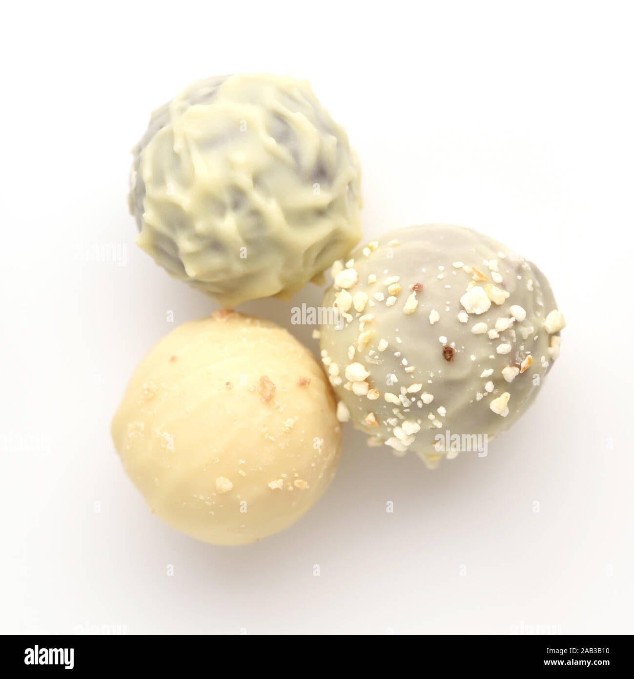 Three candies of white chocolate on white background. Top view Stock ...