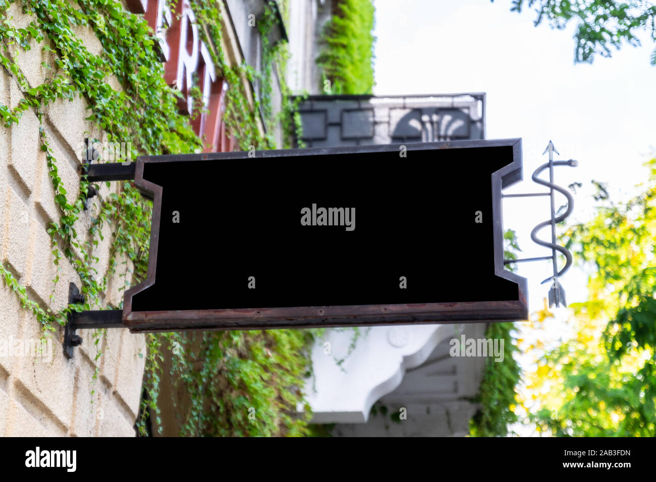 Horizontal side view of empty black signage on old architecture build ...