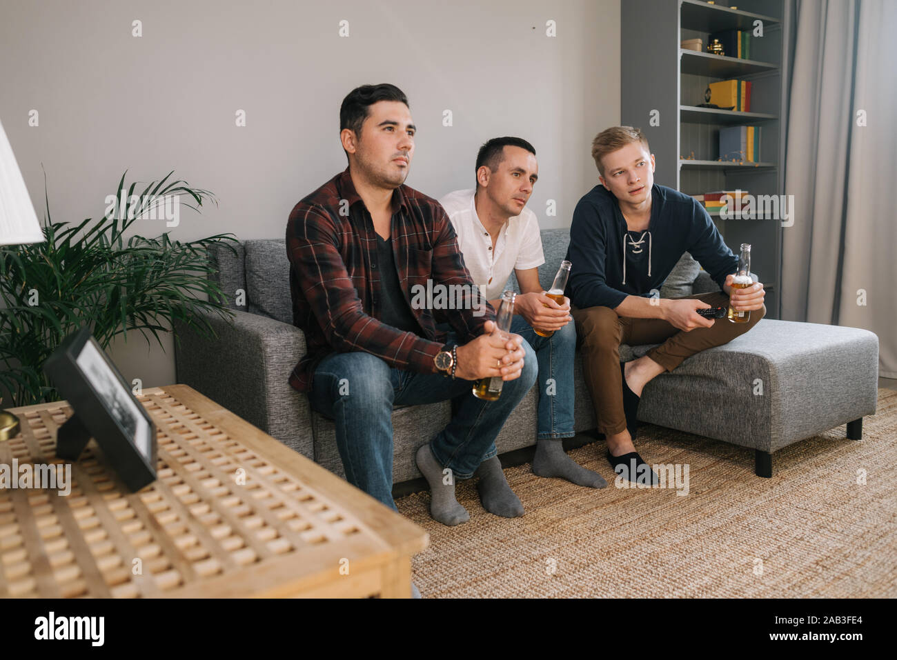 Man using remote control hi-res stock photography and images - Alamy