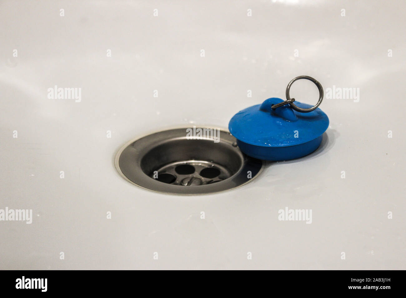 Draining water with the drain rubber plug on shower bath Stock Photo ...