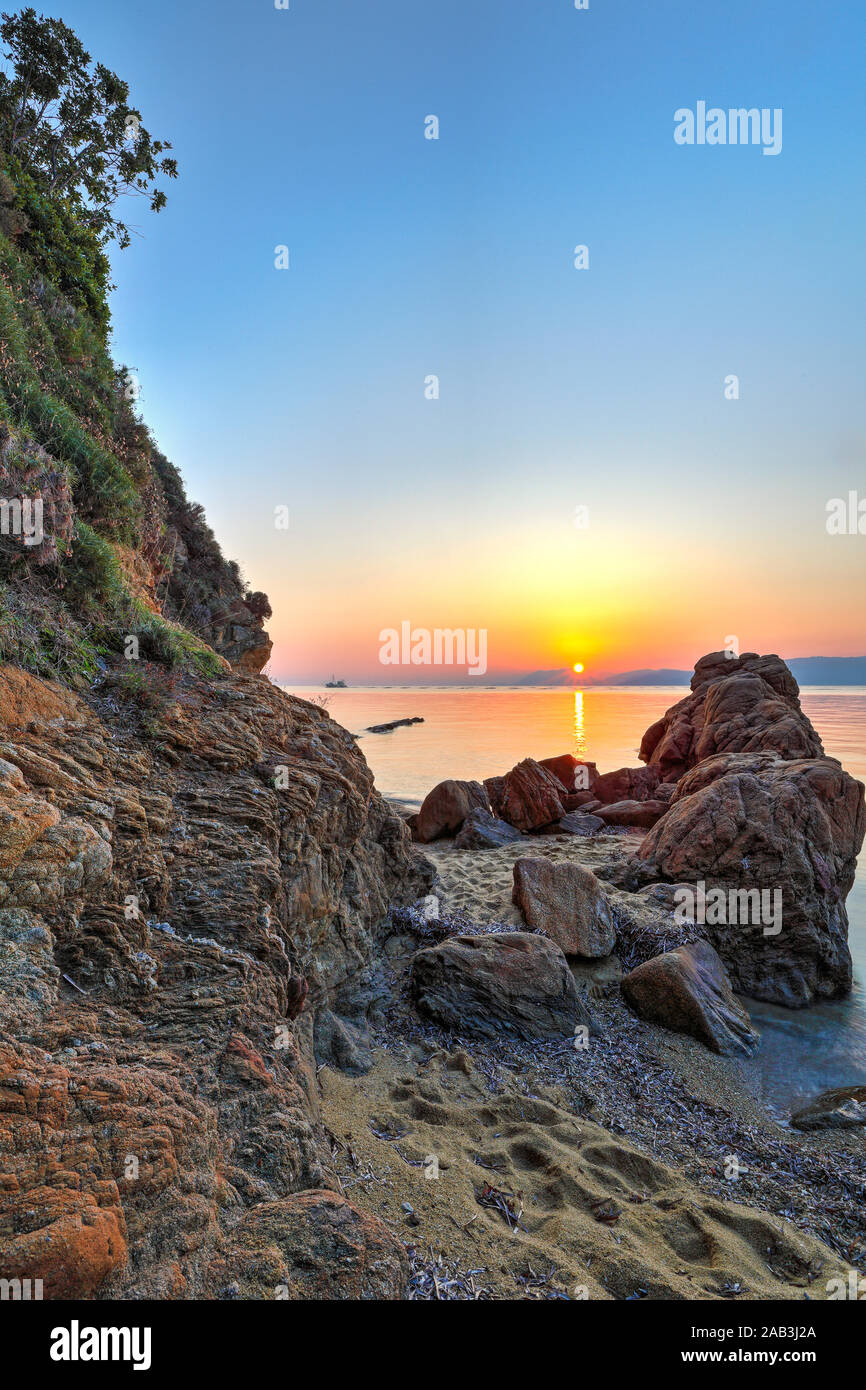 The sunset at the beach Agia Eleni of Skiathos island, Greece Stock ...