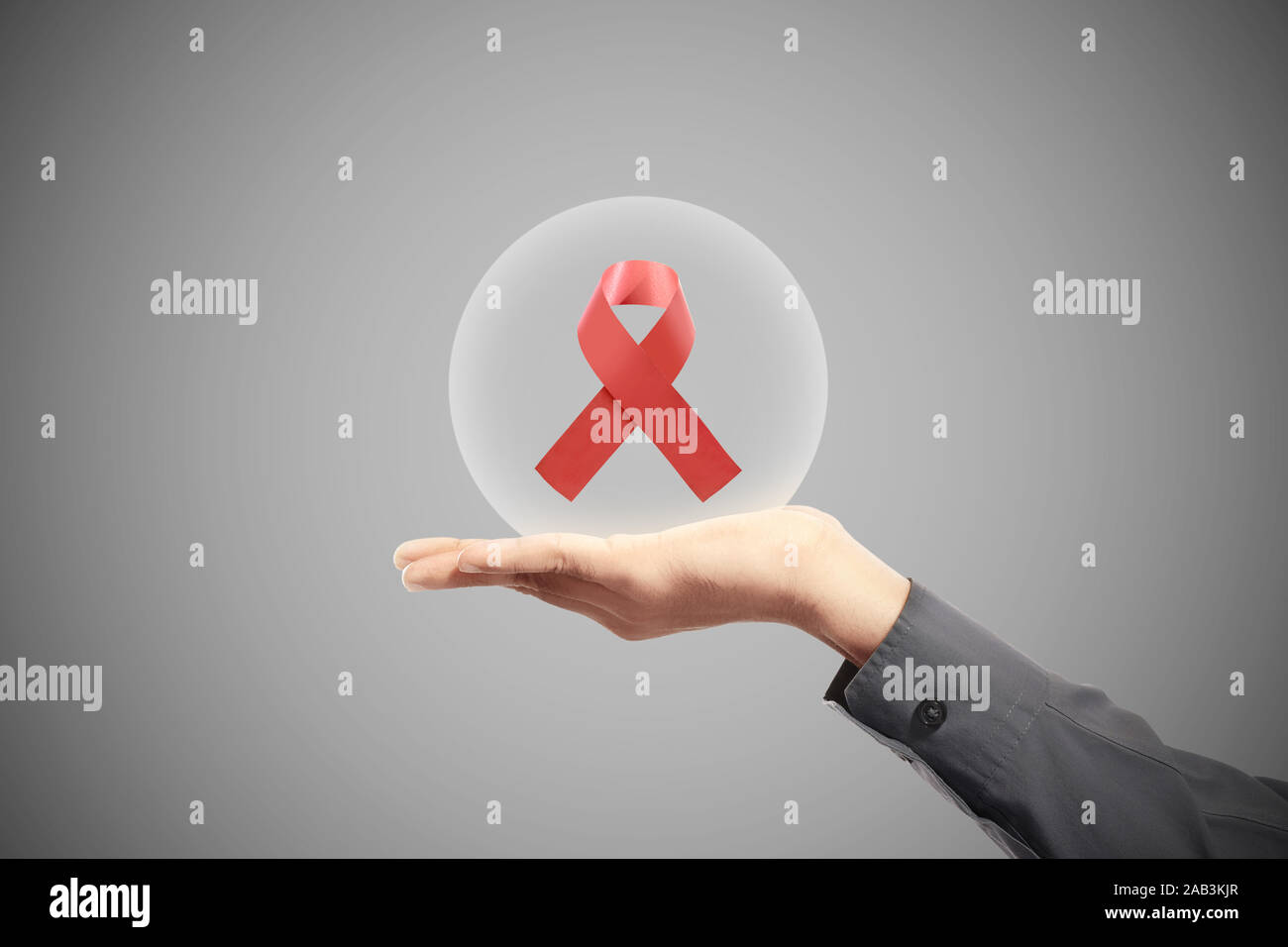 Human hands showing a red ribbon. Hiv Aids ribbon awareness Stock Photo ...