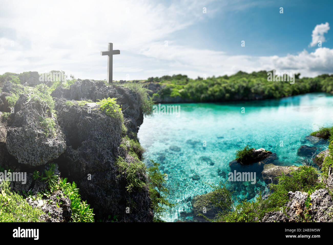 Christian cross on the edge of a cliff with a blue sky background Stock ...