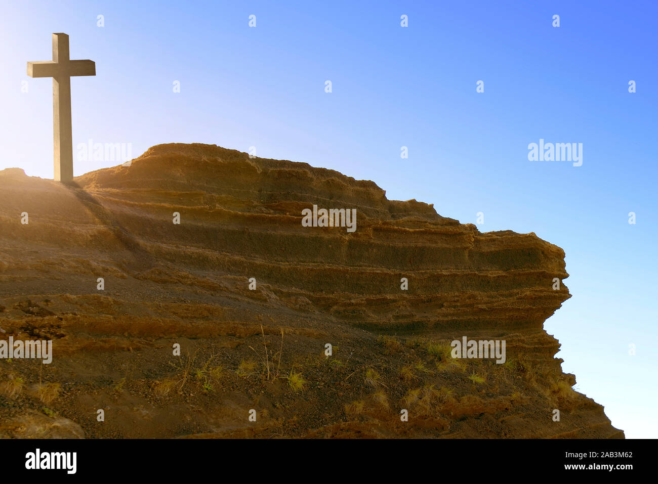 Christian cross on the edge of a cliff with a blue sky background Stock ...