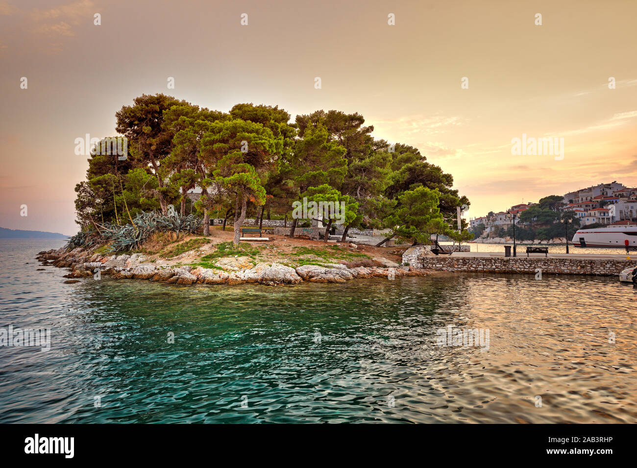 The sunset at the old port in the Chora of Skiathos island, Greece ...