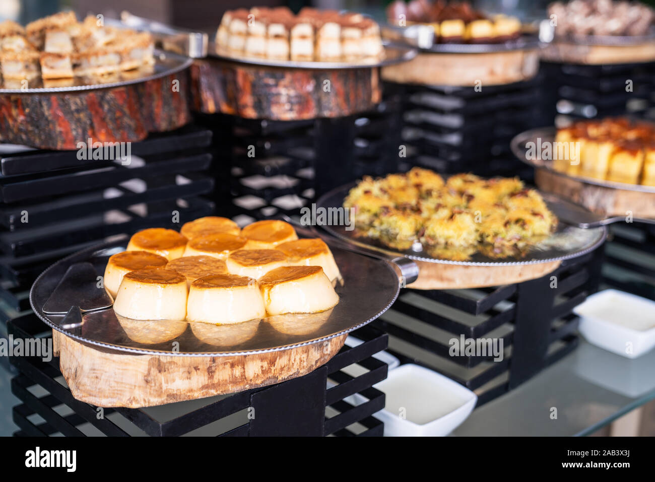 A delicious dessert buffet with various sweet bakery in a restaurant or ...