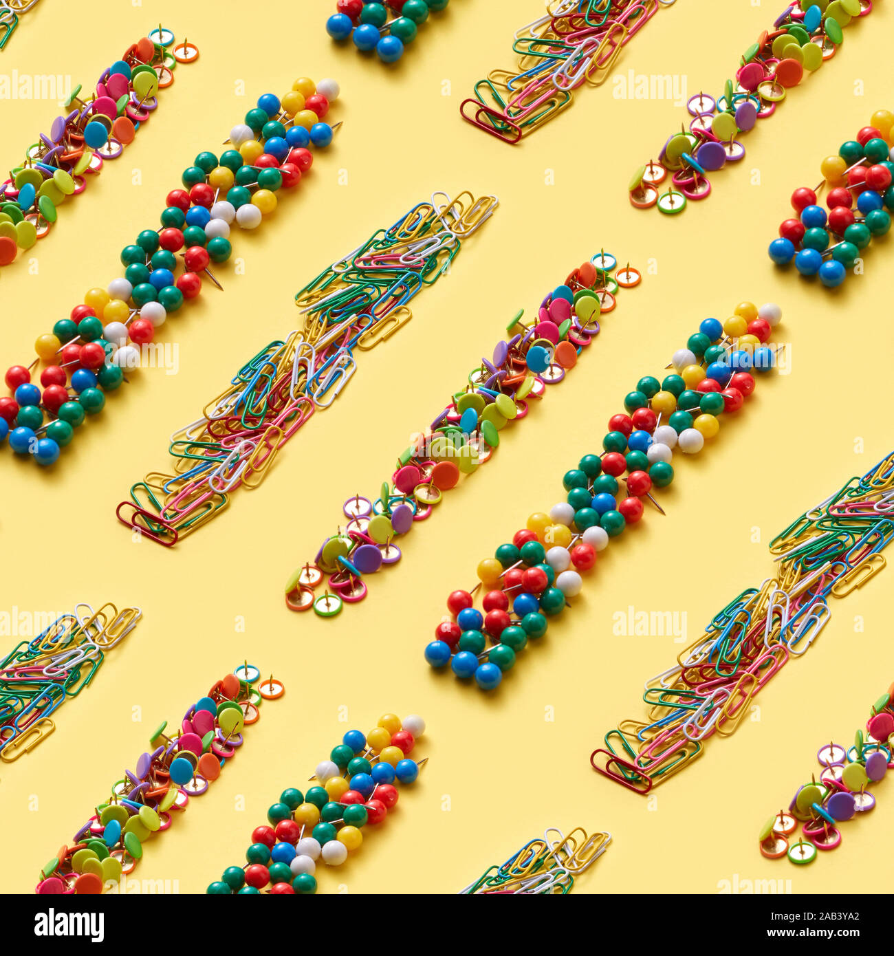 Stationery colorful pins and paper clips pattern Stock Photo - Alamy