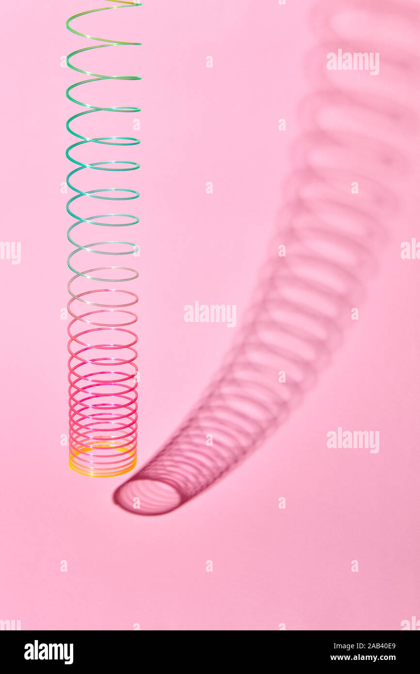 Human Hand Holding Slinky Toy