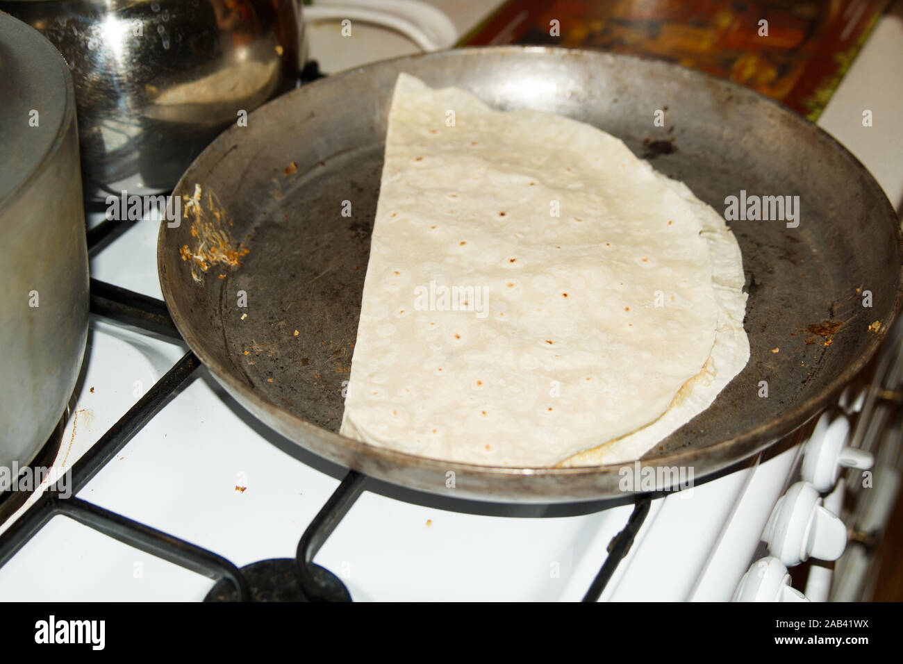 Cooking dough pita at home Stock Photo - Alamy