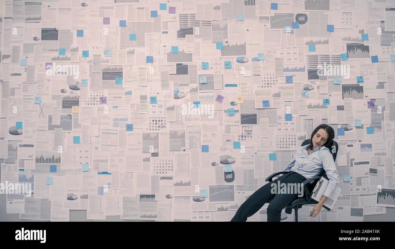 Corporate businesswoman overwhelmed by financial data, she is exhausted ...