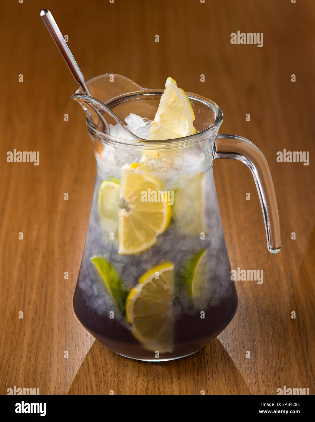 purple lemonade with ice and lemons Stock Photo - Alamy