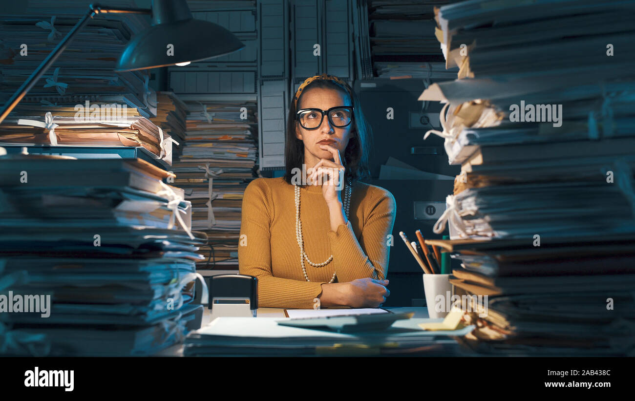 Woman surrounded by paperwork hi-res stock photography and images - Alamy
