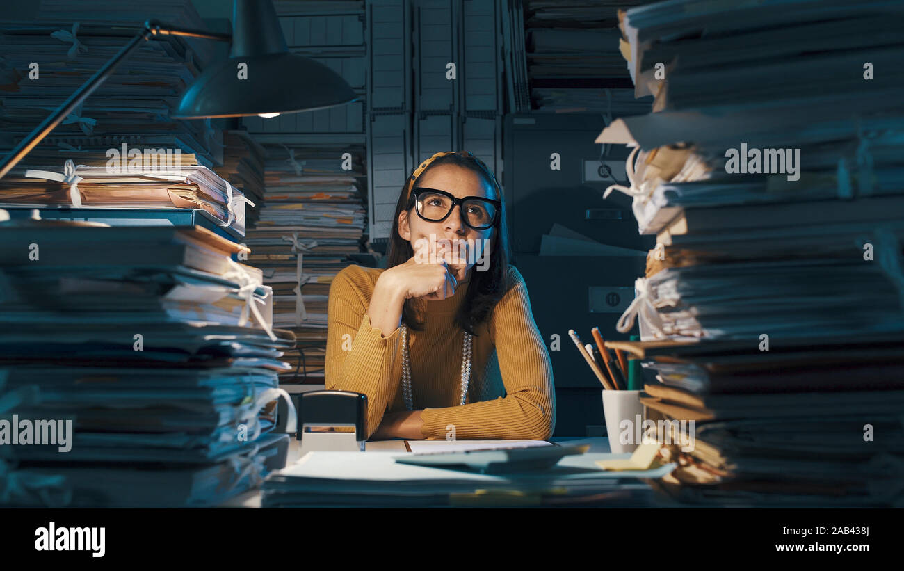 Woman surrounded by paperwork hi-res stock photography and images - Alamy