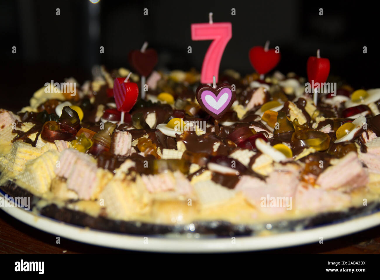 Birthday cake with wafers chocolate and candle number seven Stock Photo ...