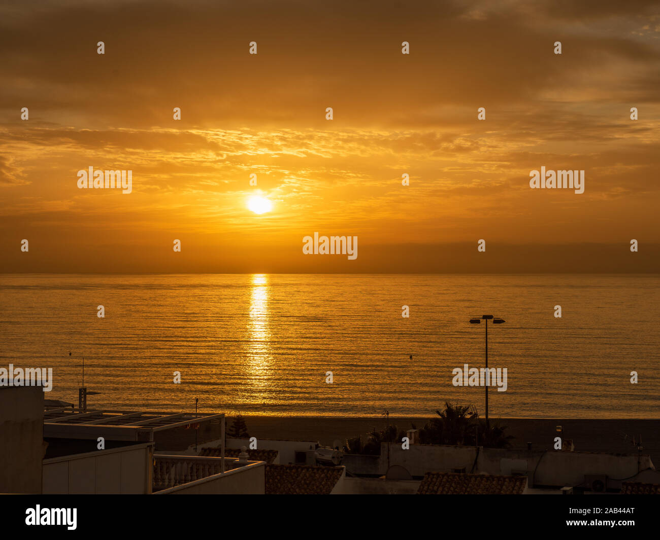 Beautiful sunrise on the beach. Bright sunrise Stock Photo - Alamy