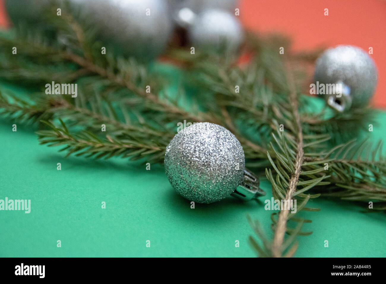 Christmas photos with silver tree balls and conifer branches on a red ...