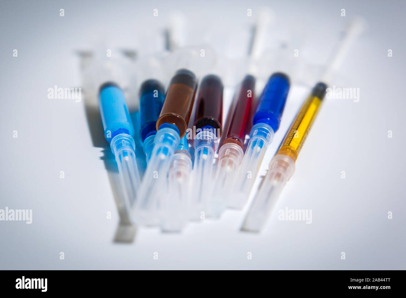 Medical syringes with colorful injections for cosmetology. Syringes ...