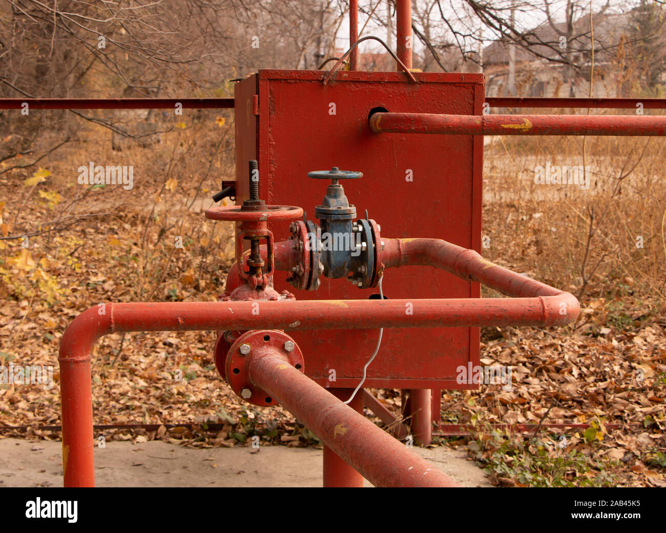 Gas pipes in the city pipes painted in red Stock Photo - Alamy
