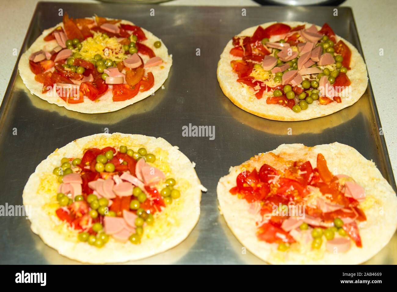 Cooking pizza at home Stock Photo - Alamy