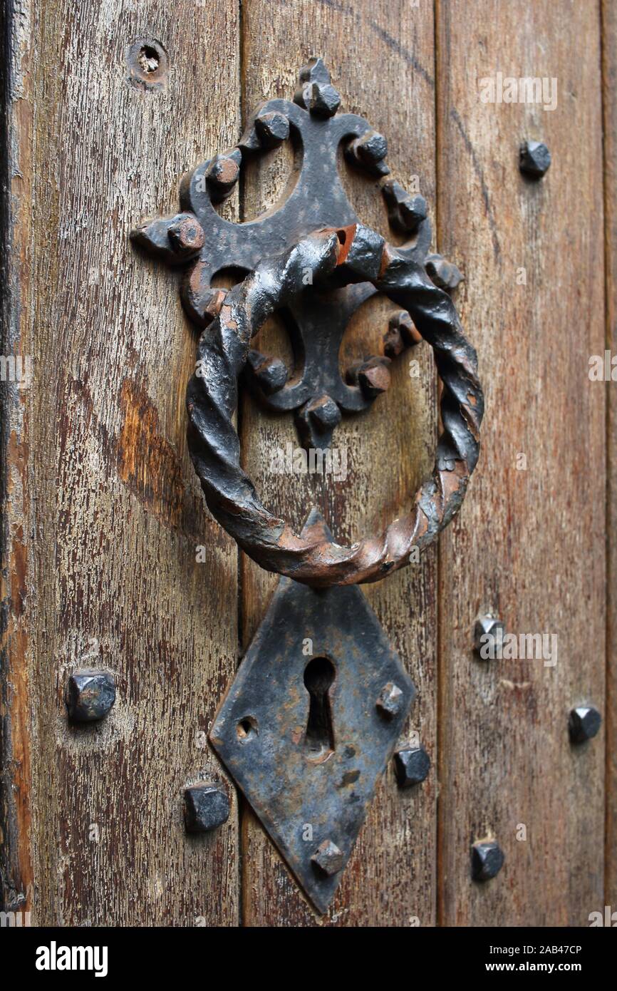 Medieval door knocker and keyhole Stock Photo - Alamy