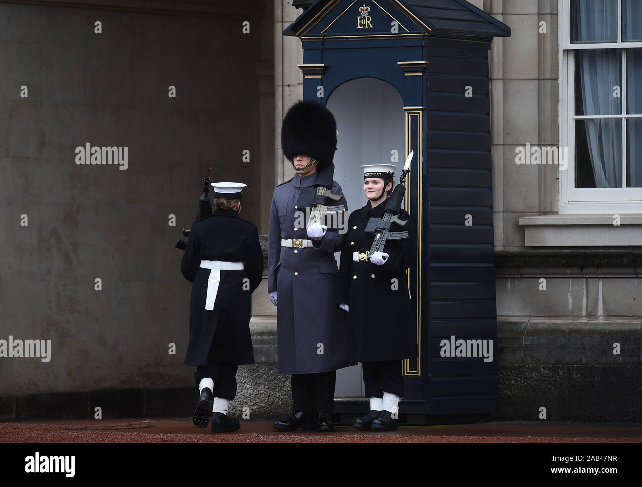 Sailors (left and right) from the Royal Navy perform the Changing of ...