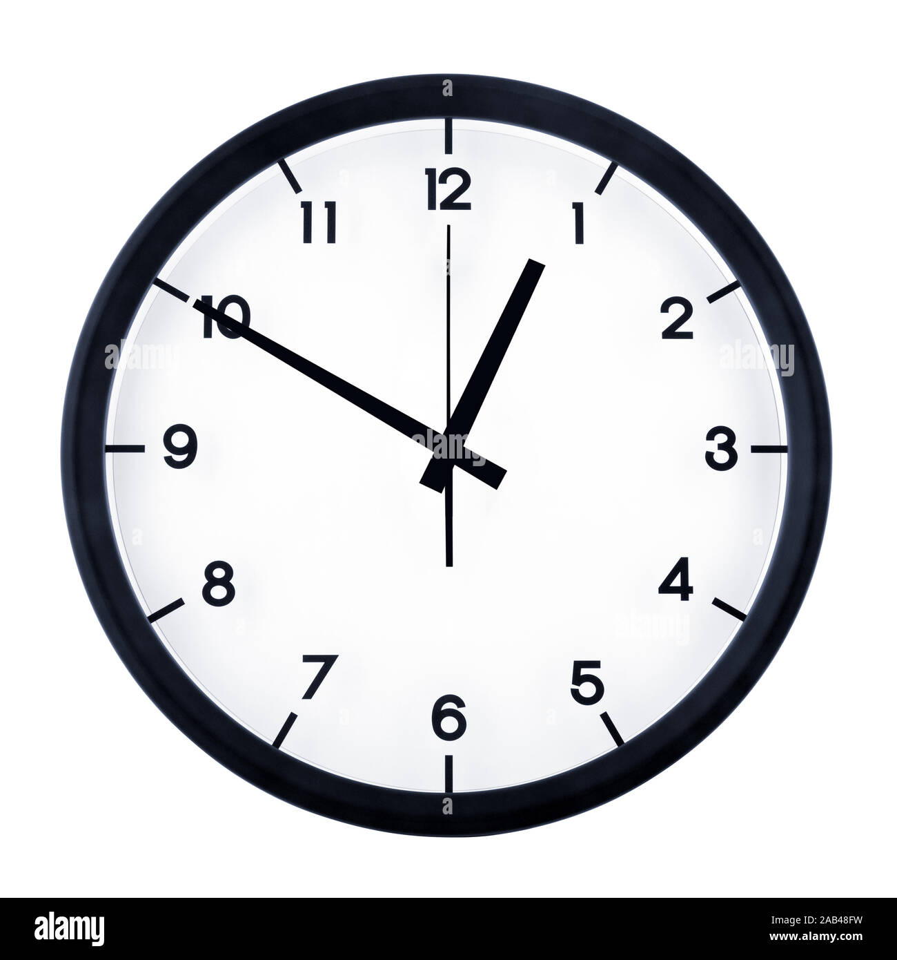 Classic analog clock pointing at twelve fifty, isolated on white ...