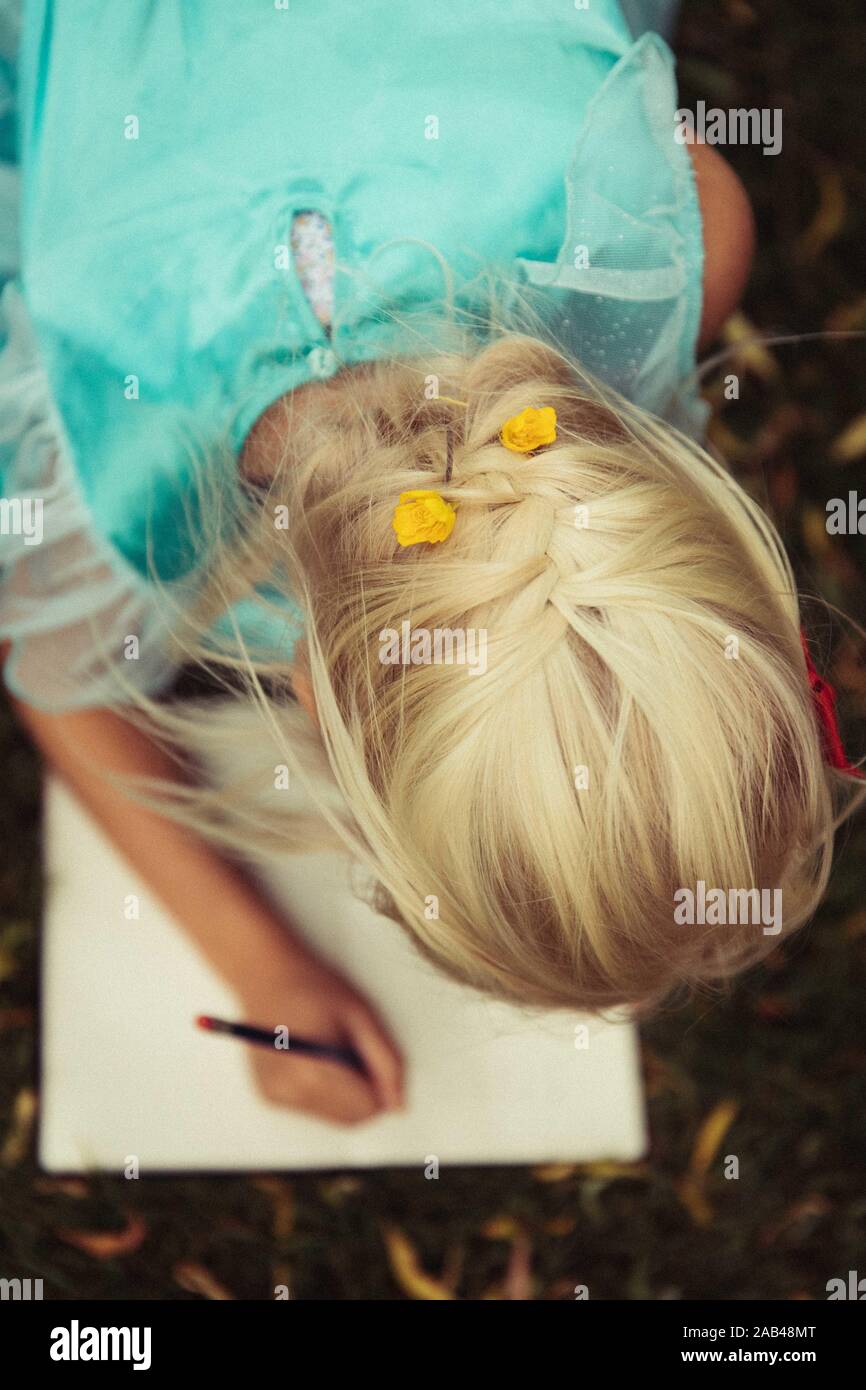 Blonde child writing letters Stock Photo - Alamy