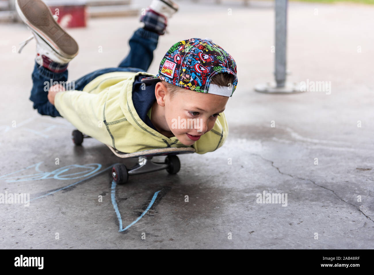 A cute little boy with ADHD, autism, Asperger syndrome riding around ...