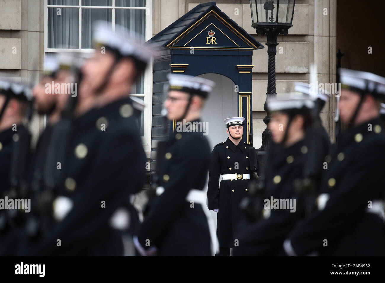 Sailors from the Royal Navy perform the Changing of the Guard ceremony ...