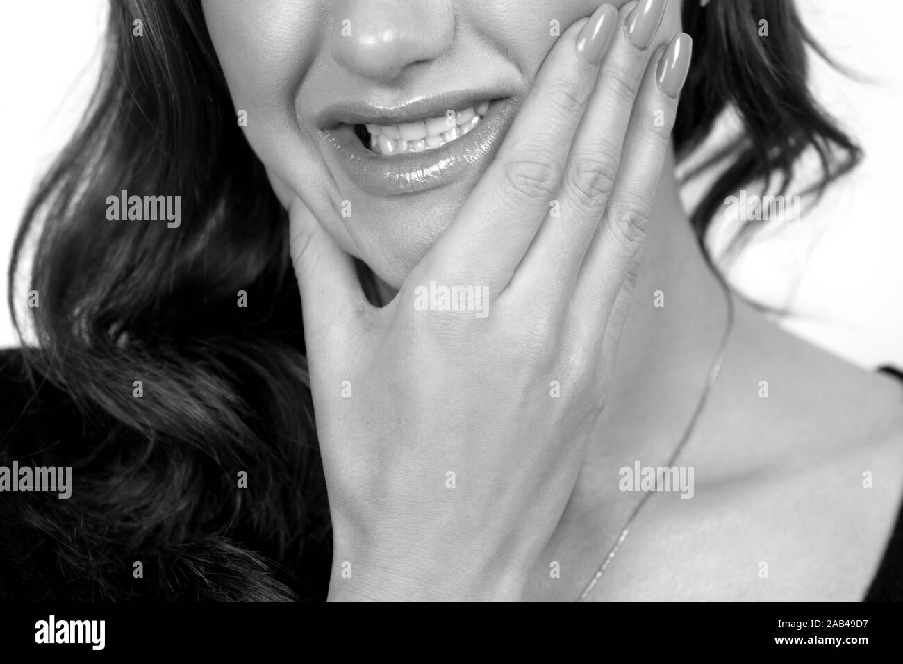 Beautiful young woman suffering from toothache, closeup shot, white ...