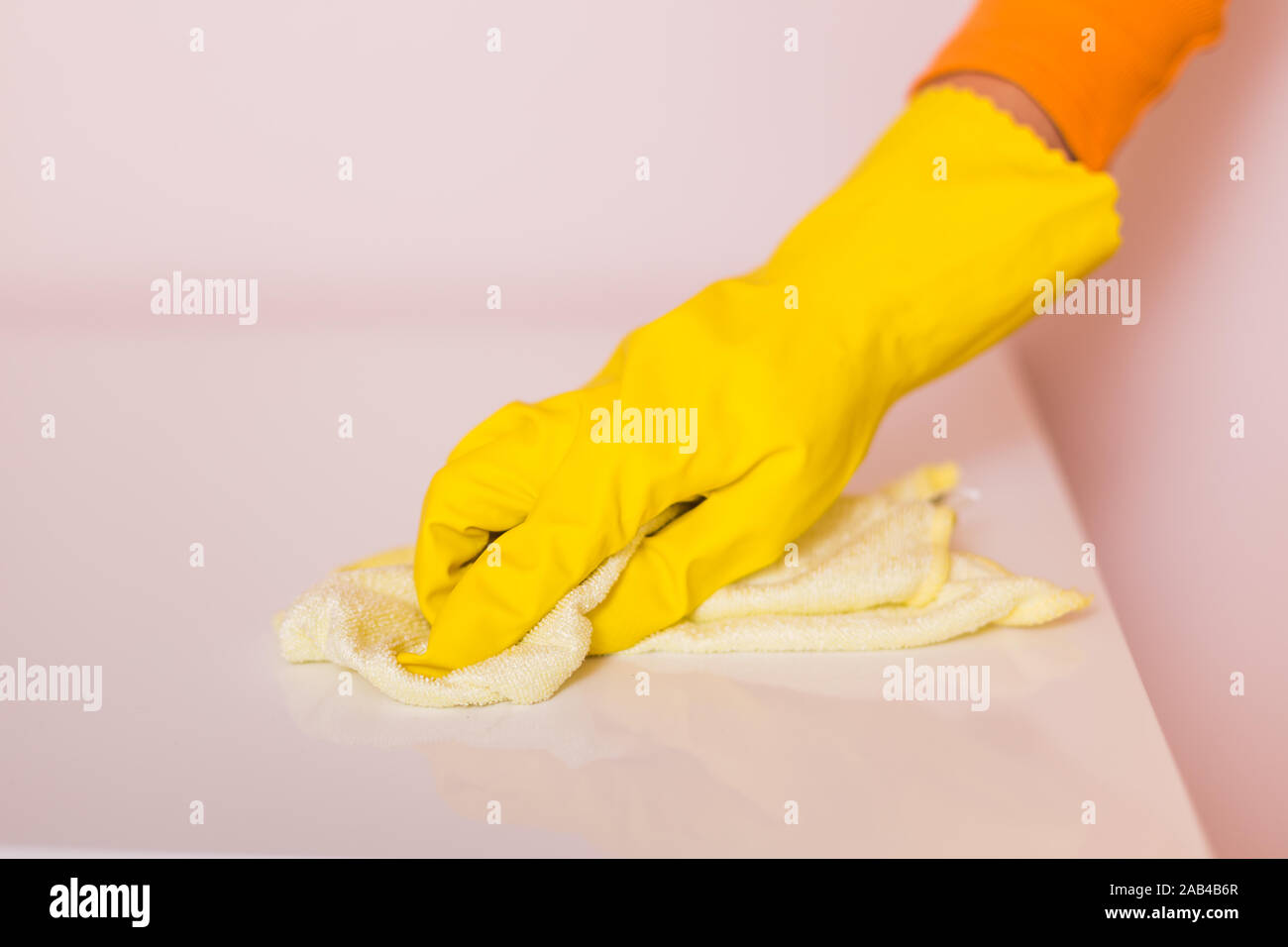 Image of housewife cleaning table with mop Stock Photo - Alamy