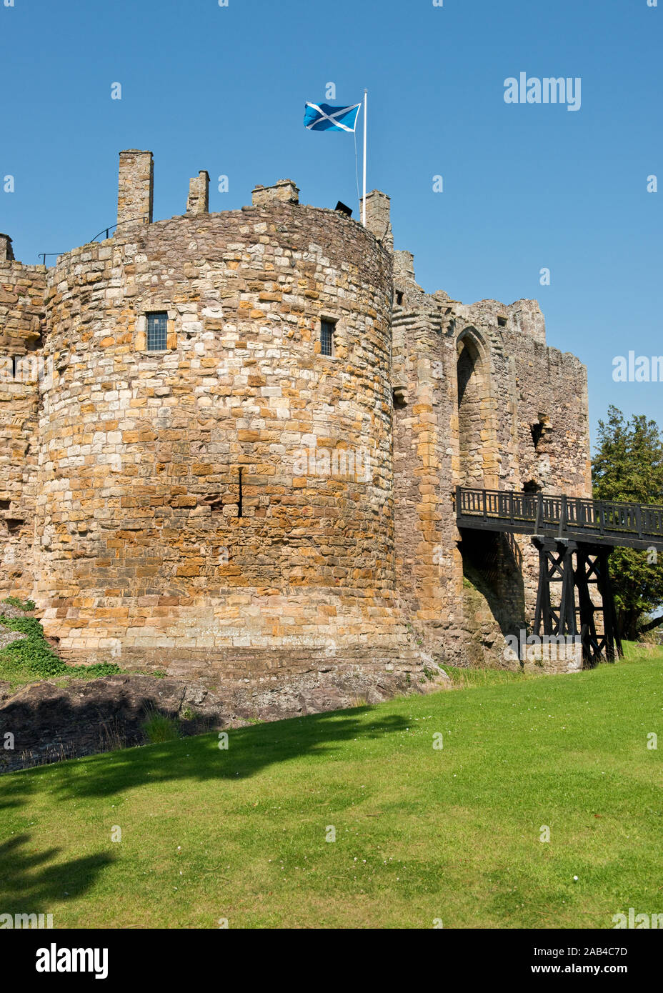 Dirleton Castle with defensive wide, wooden bridge and gatehouse. East ...