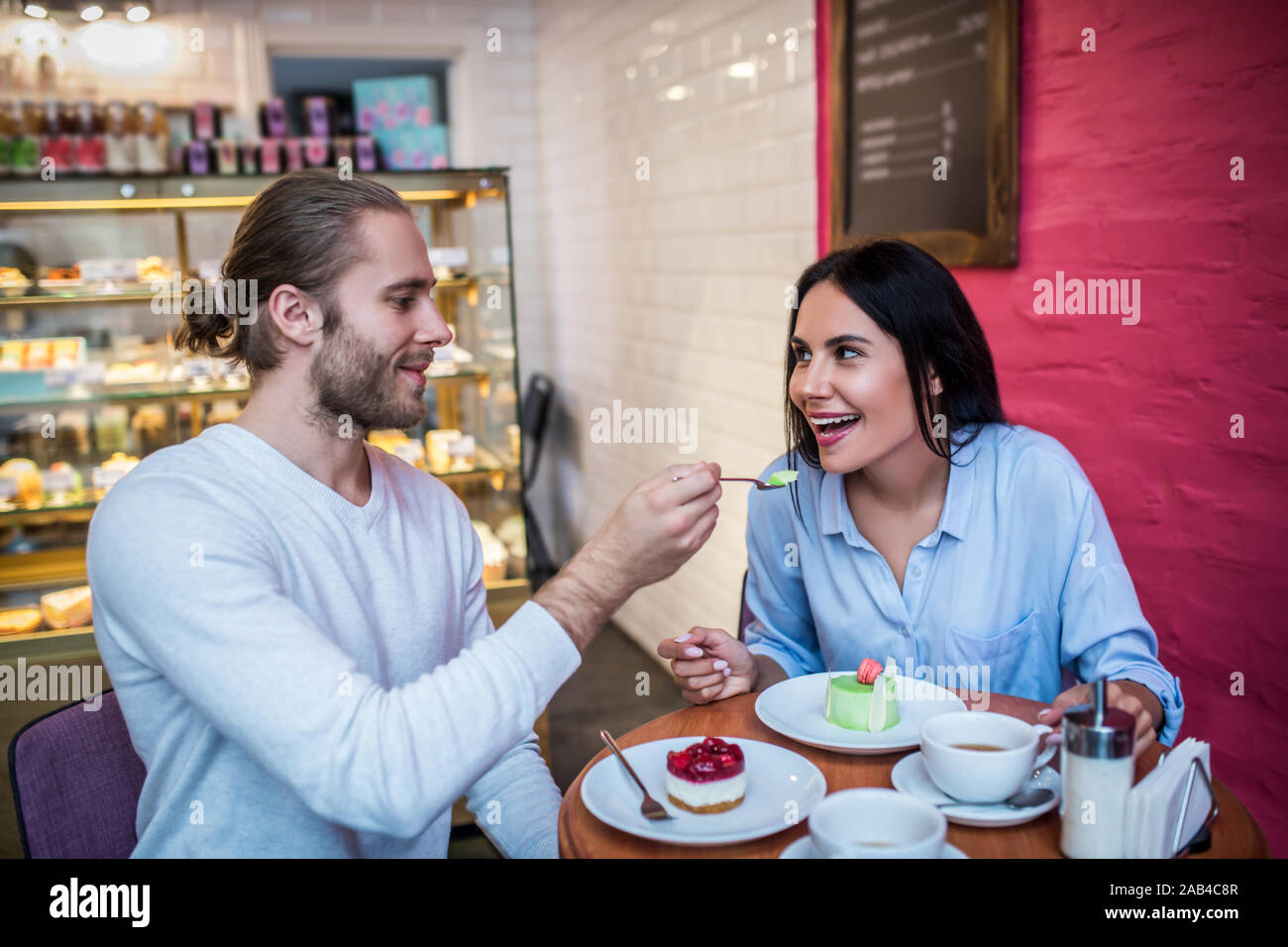 Loving caring boyfriend giving dessert to his girlfriend Stock Photo ...