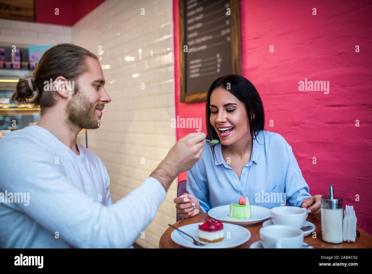 Happy wife feeling excited before trying yummy dessert Stock Photo - Alamy