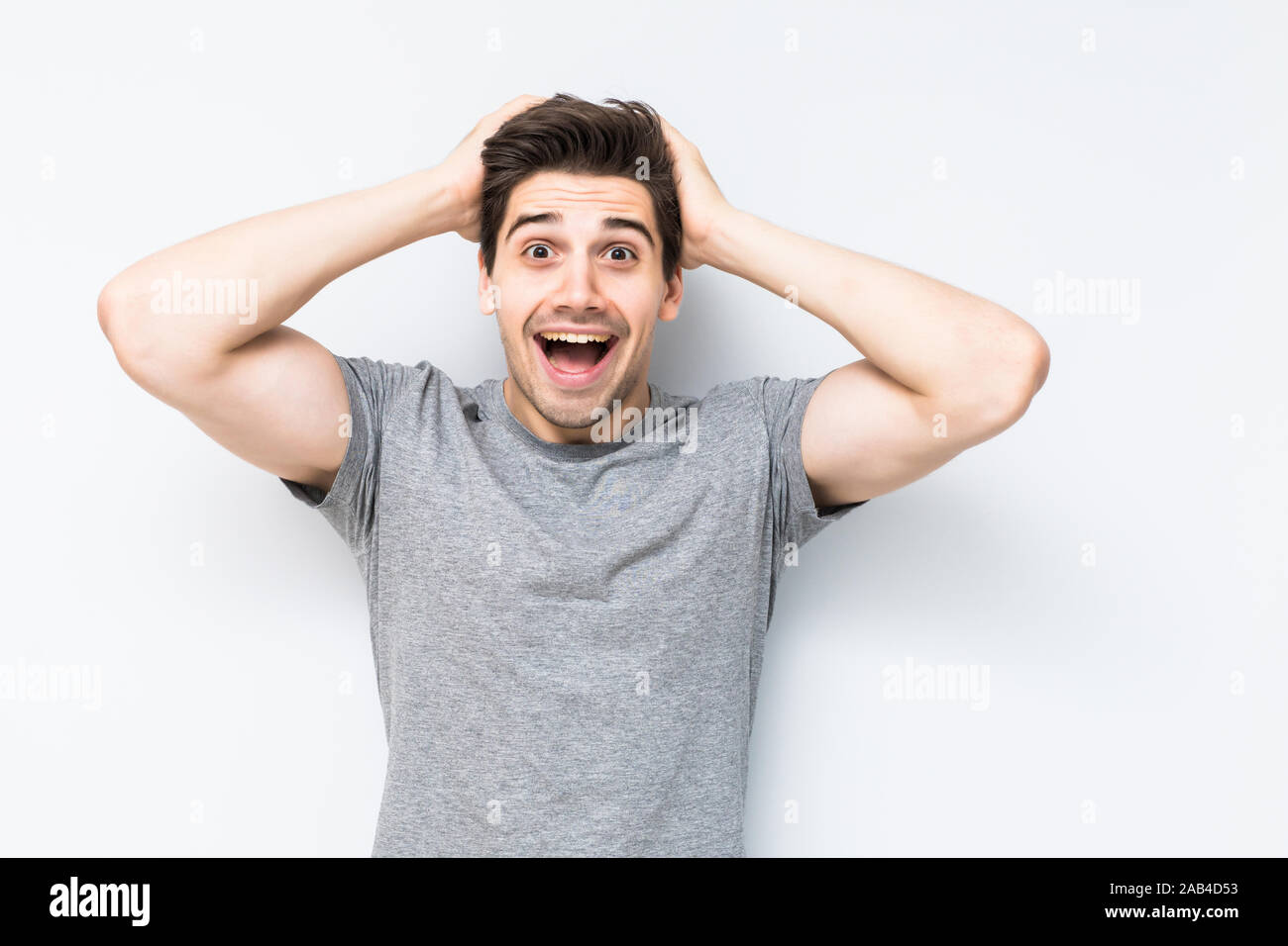 Shocked man isolated on white background Stock Photo - Alamy