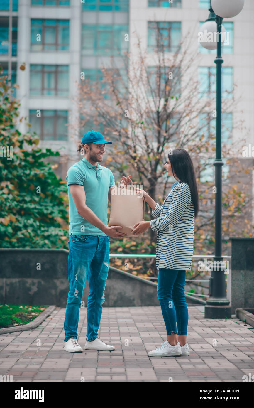 Man passing bag hi-res stock photography and images - Alamy