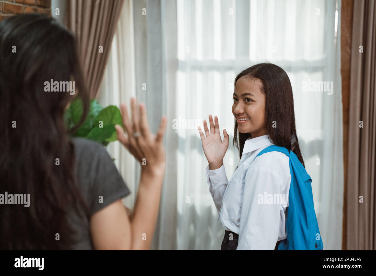 Teenager Waving Goodbye High Resolution Stock Photography and Images ...