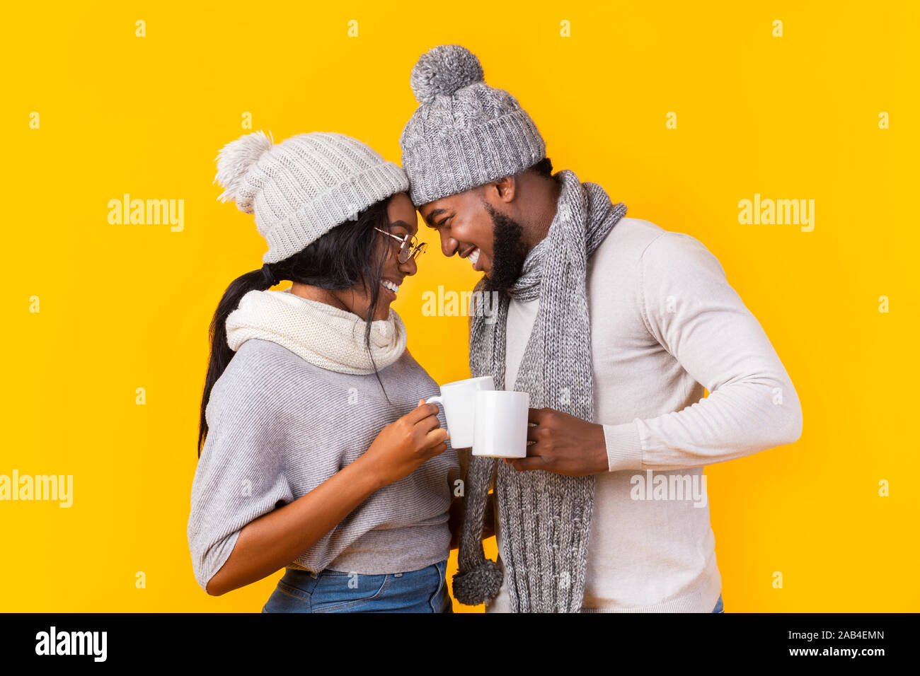 Afro couple bonding while having hot drink Stock Photo - Alamy