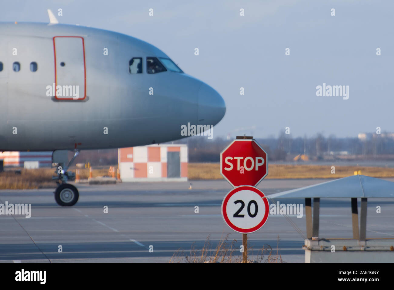 Stop sign on the road service vehicles on the platform of the airport ...
