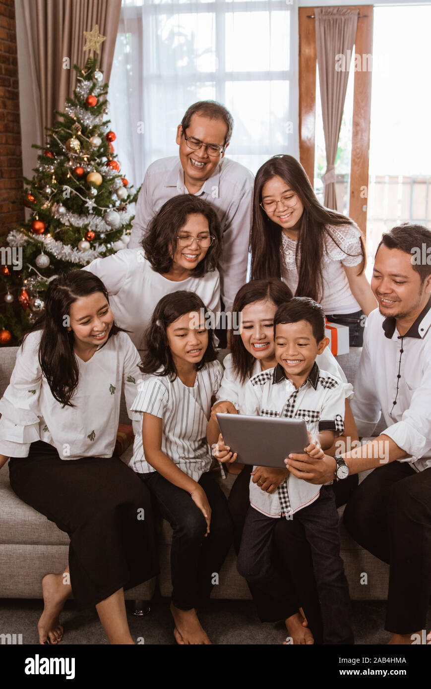 family video call with friend using tablet pc Stock Photo - Alamy