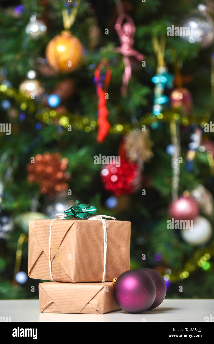 Gift wrapped christmas presents under the decorated christmas tree in ...