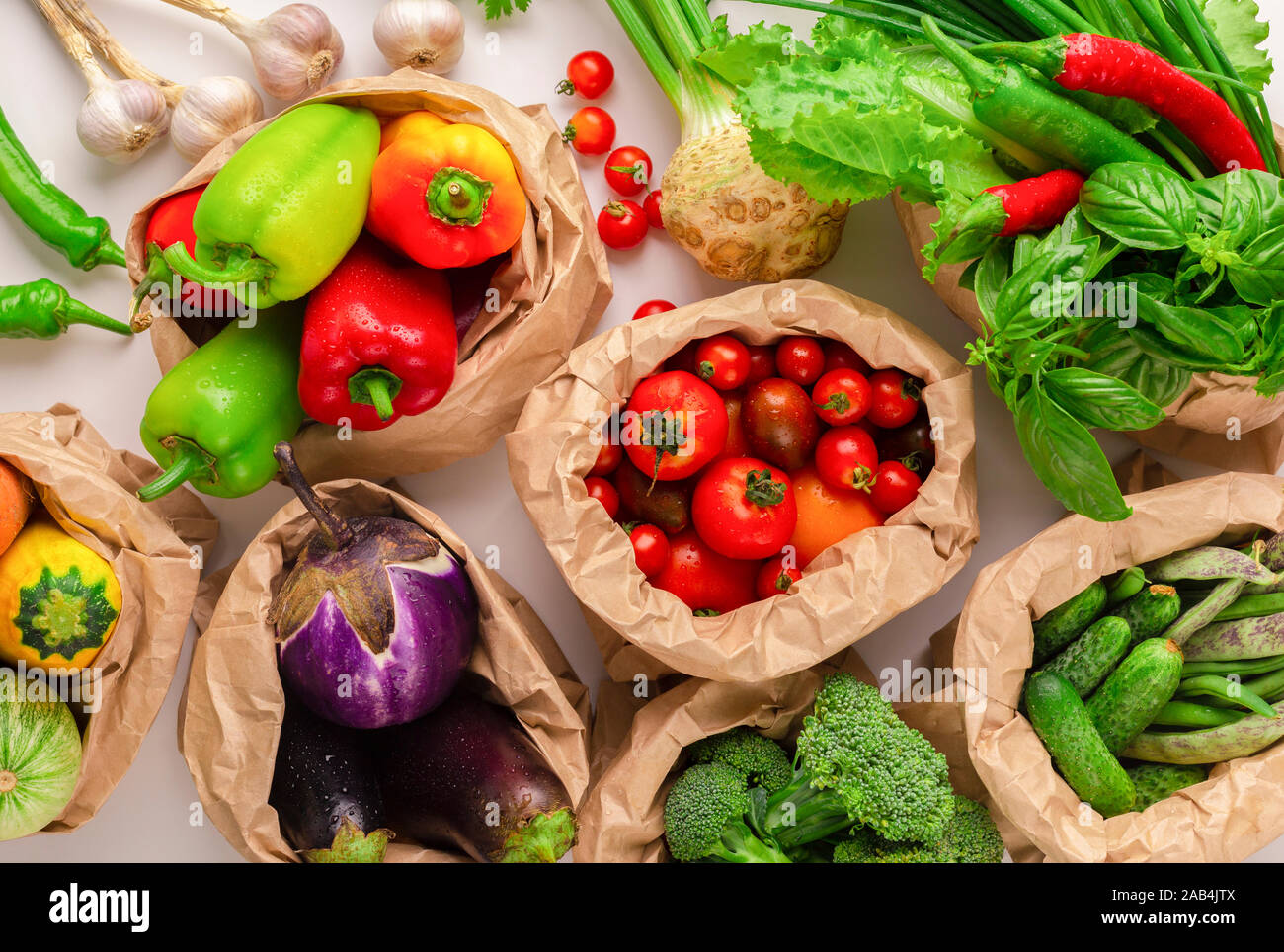 Assorted raw organic vegetables from garden in zero waste packages ...