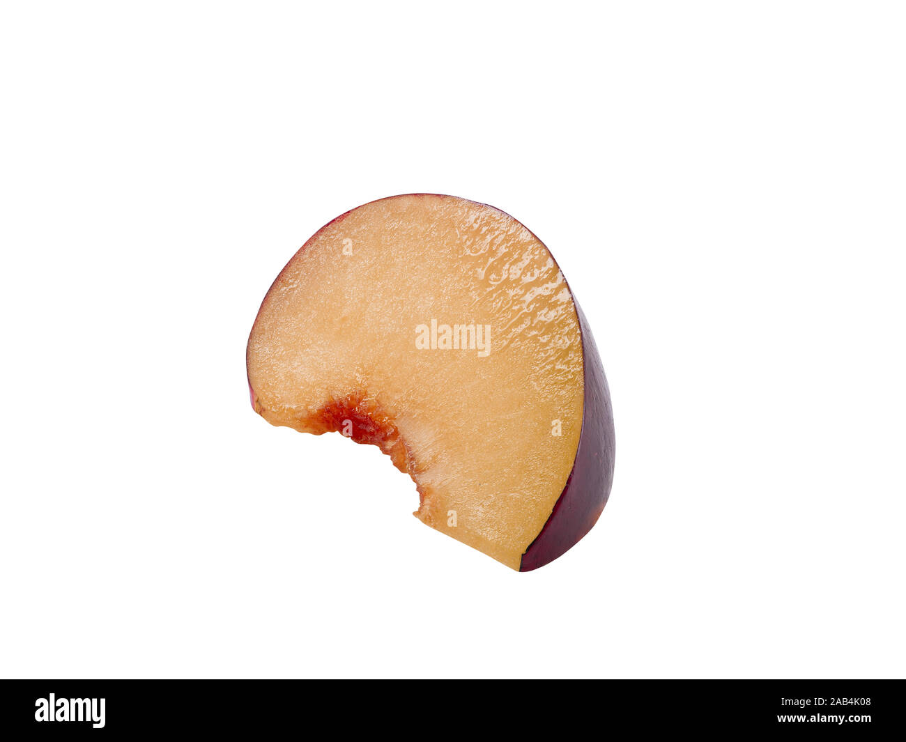 Slice of smooth-skinned, purple plum fruit without kernel isolated on ...