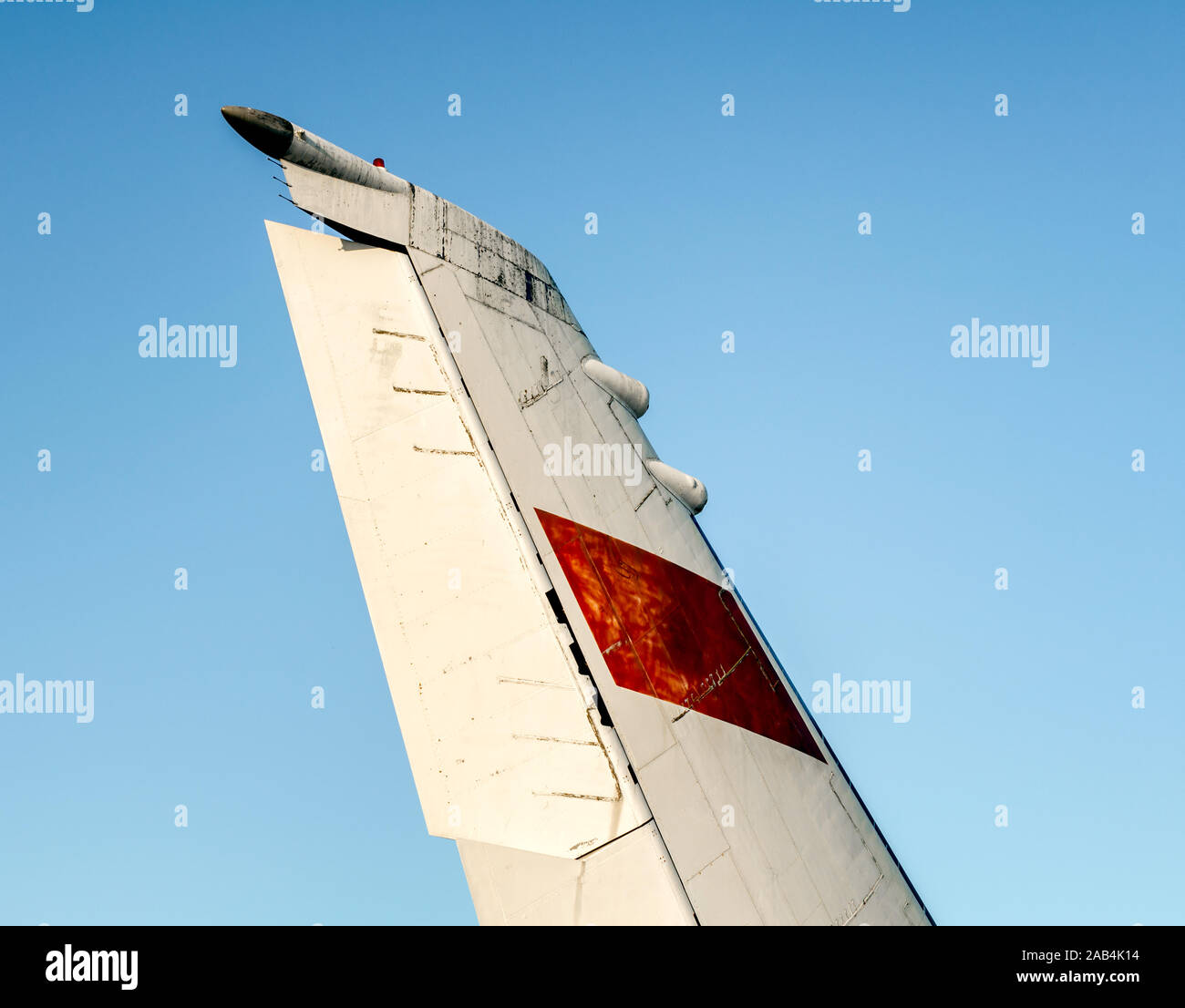 background wing of a large soviet airliner against a blue sky isolated ...