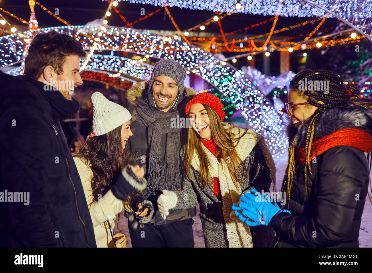 Group of friends on street at night hi-res stock photography and images ...