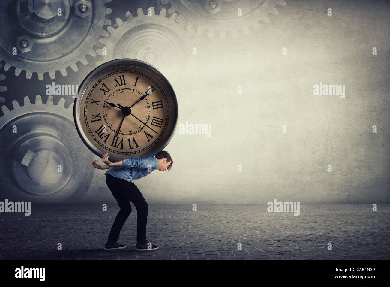 Bent down guy carrying a big heavy clock on his back. Overloaded ...